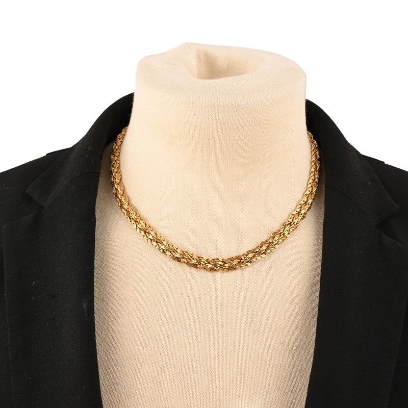 A gold necklace | Woolley and Wallis