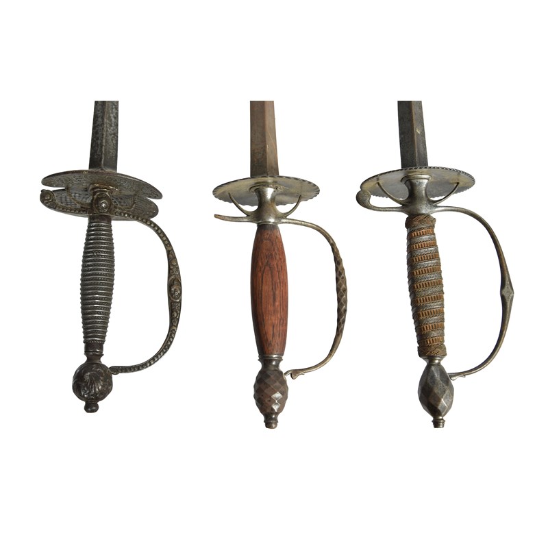 A small collection of court swords and related weapons, comprising: a ...