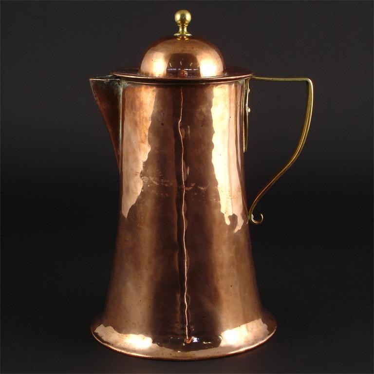 A birmingham guild of handicrafts copper jug probably designed by ...