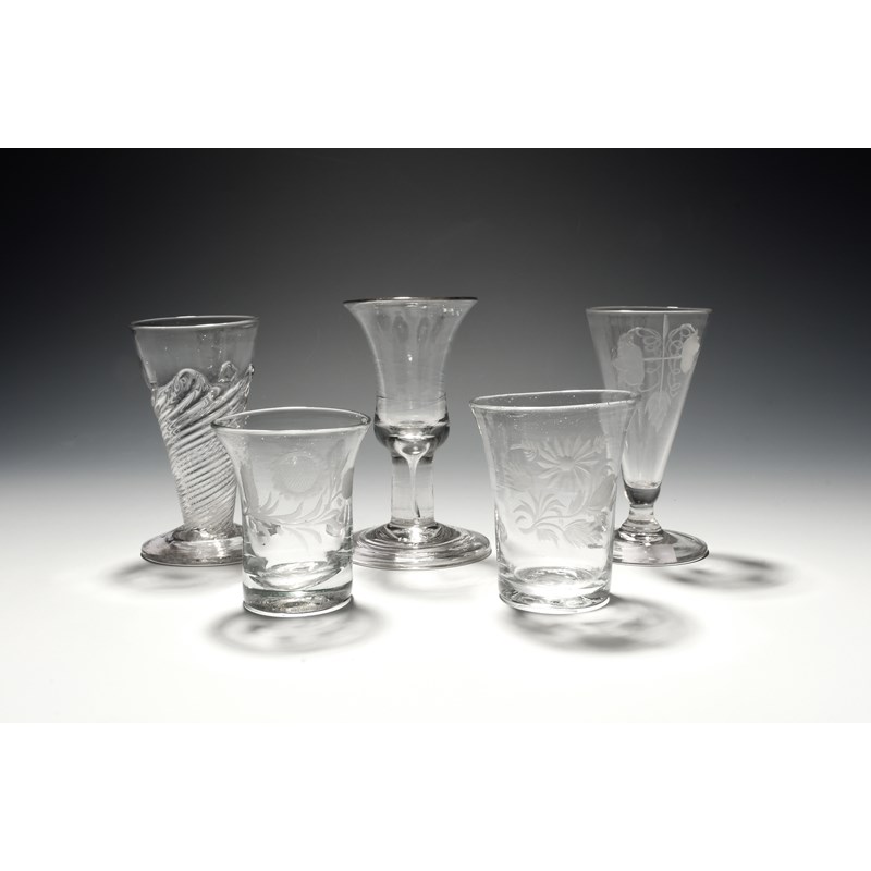 An early dwarf ale glass, c.1730, with flammiform moulding to the drawn ...
