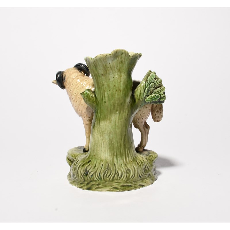 A staffordshire pearlware spill vase, c.1800, modelled with a sheep ...