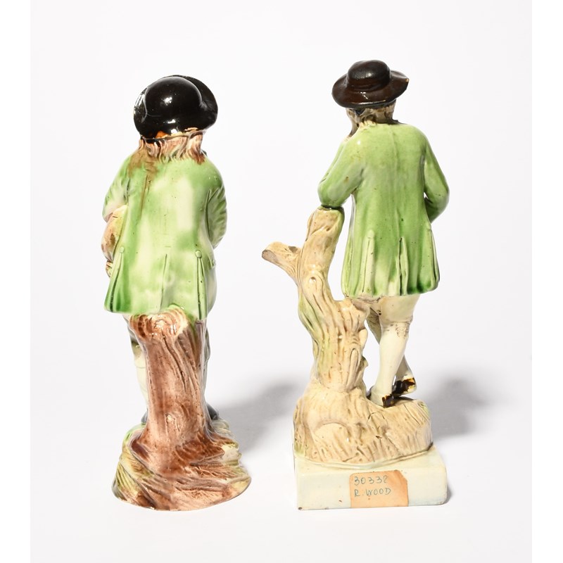 Two ralph wood figures, c.1785-95, one of a gardener leaning on a tree ...