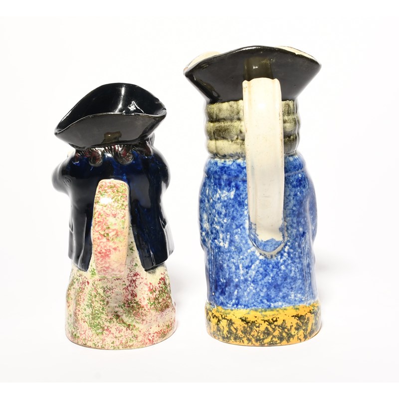 A yorkshire standing toby jug, c.1810-20, holding a glass and bottle ...