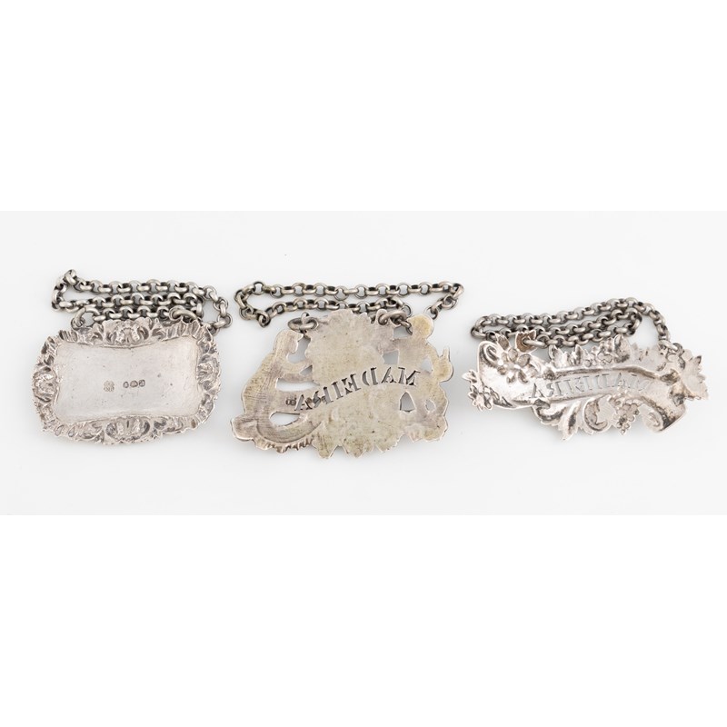 Three antique silver wine labels, | Woolley and Wallis