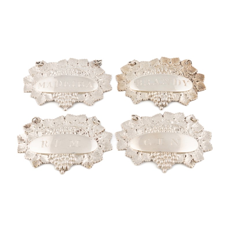 A set of four victorian silver wine labels, | Woolley and Wallis