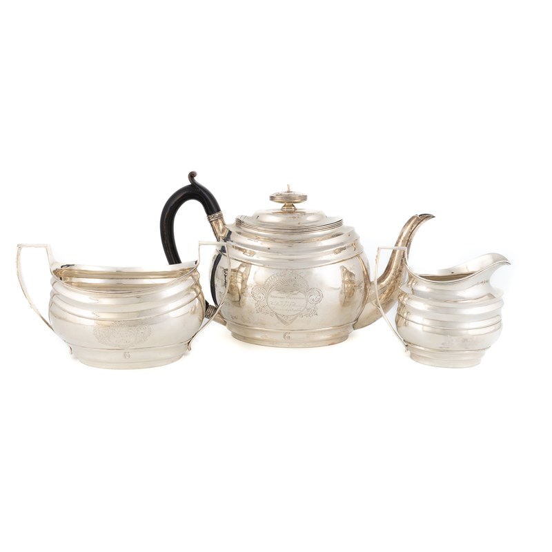 A three-piece george iii presentation silver tea set, | Woolley and Wallis