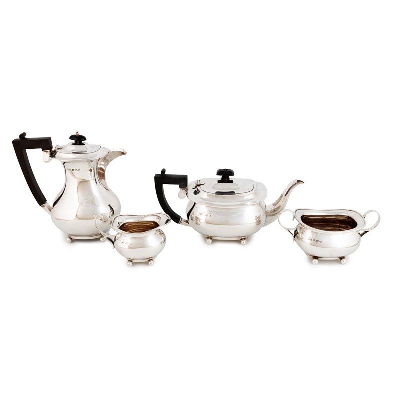 A matched four-piece silver tea and coffee set, | Woolley and Wallis