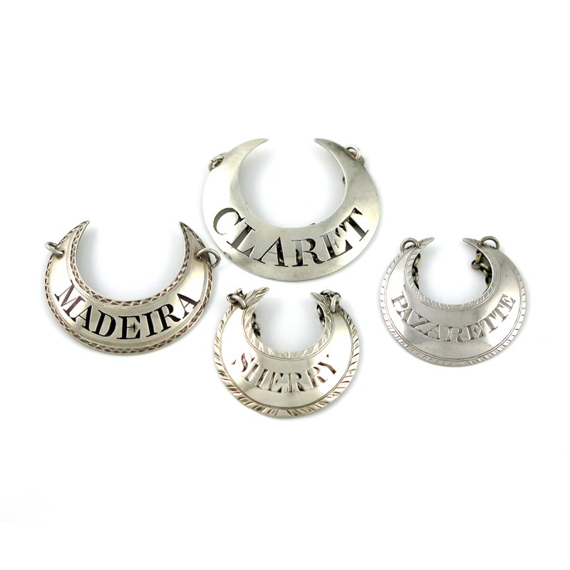 A small collection of four georgian silver wine labels | Woolley and Wallis