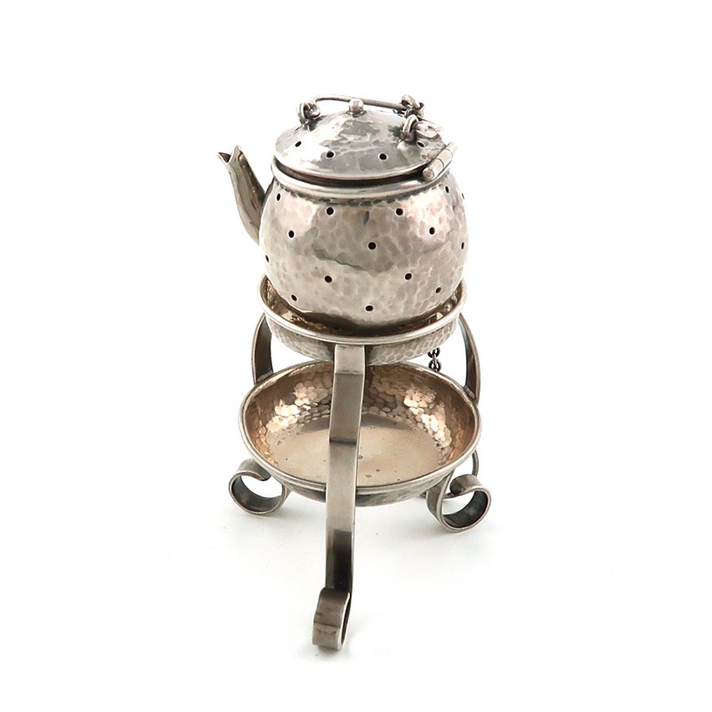 An american novelty silver tea infuser, | Woolley and Wallis