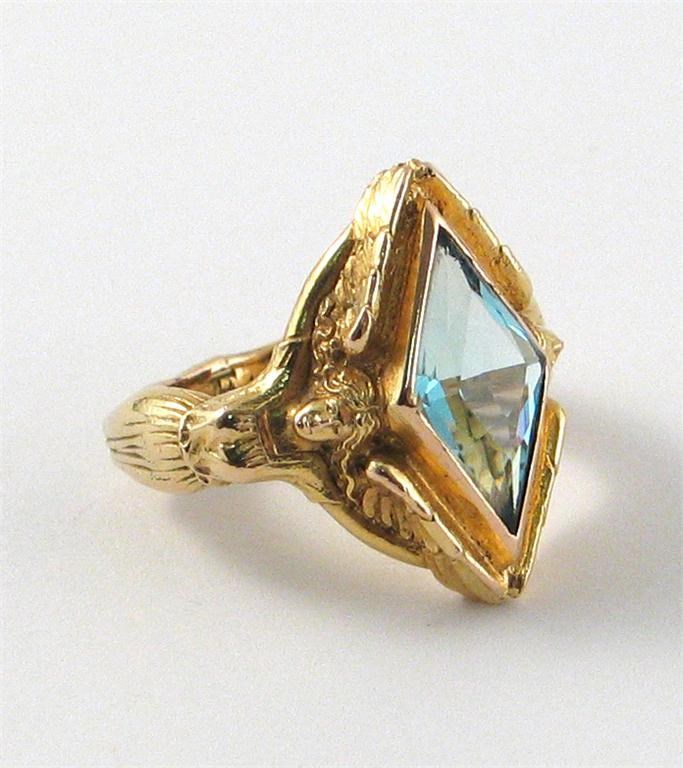 Omar ramsden: an arts and crafts aquamarine and 18ct yellow gold ring c ...