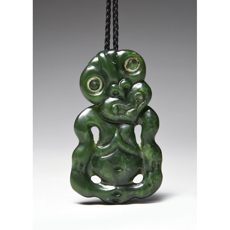 A modern maori he-tiki pendant by ewan parker | Woolley and Wallis