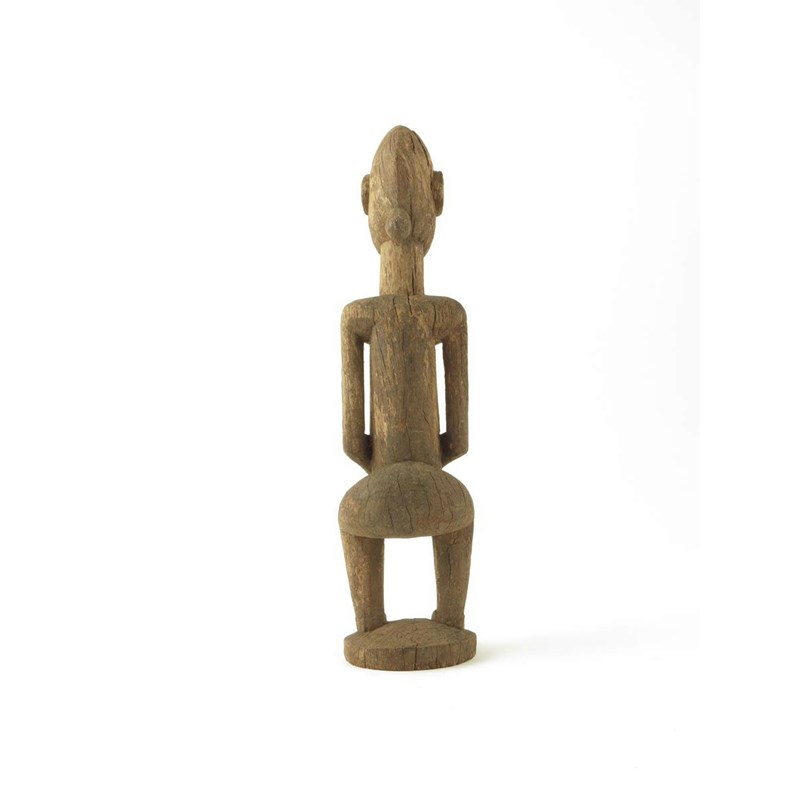 A dogon wood female figure | Woolley and Wallis